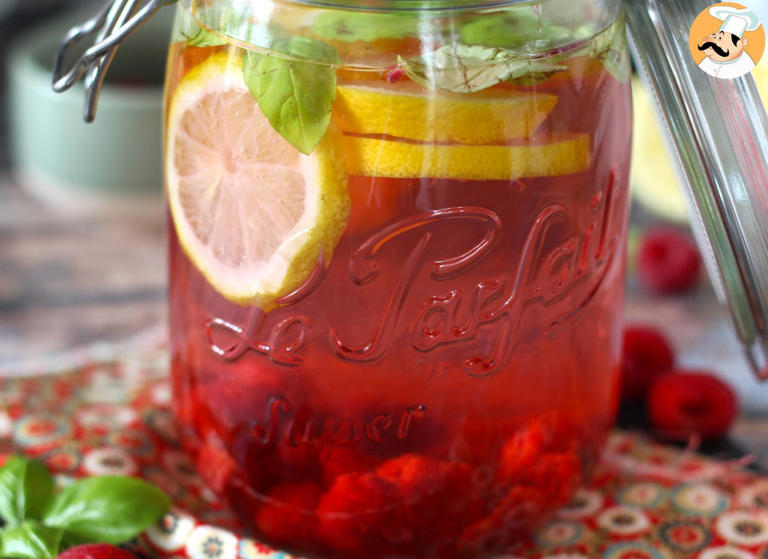 Homemade flavored water with lemon, basil and raspberry