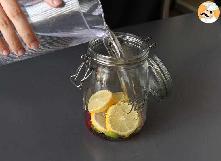 Homemade flavored water with lemon, basil and raspberry