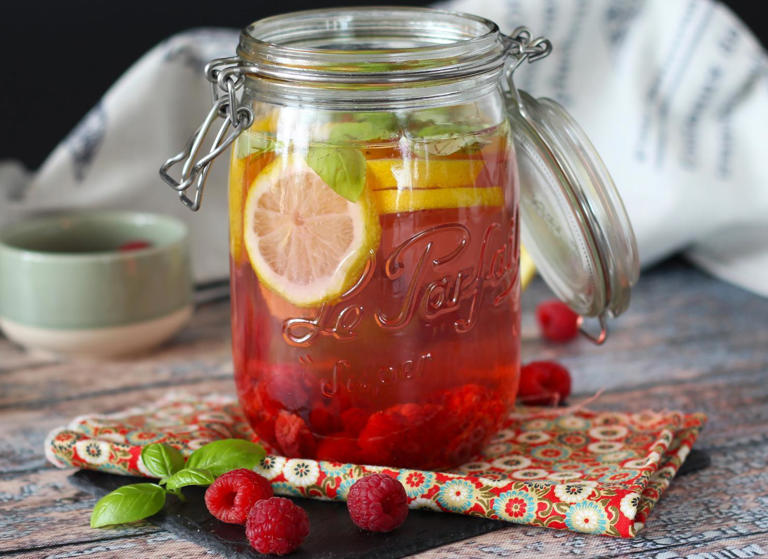 Homemade flavored water with lemon, basil and raspberry