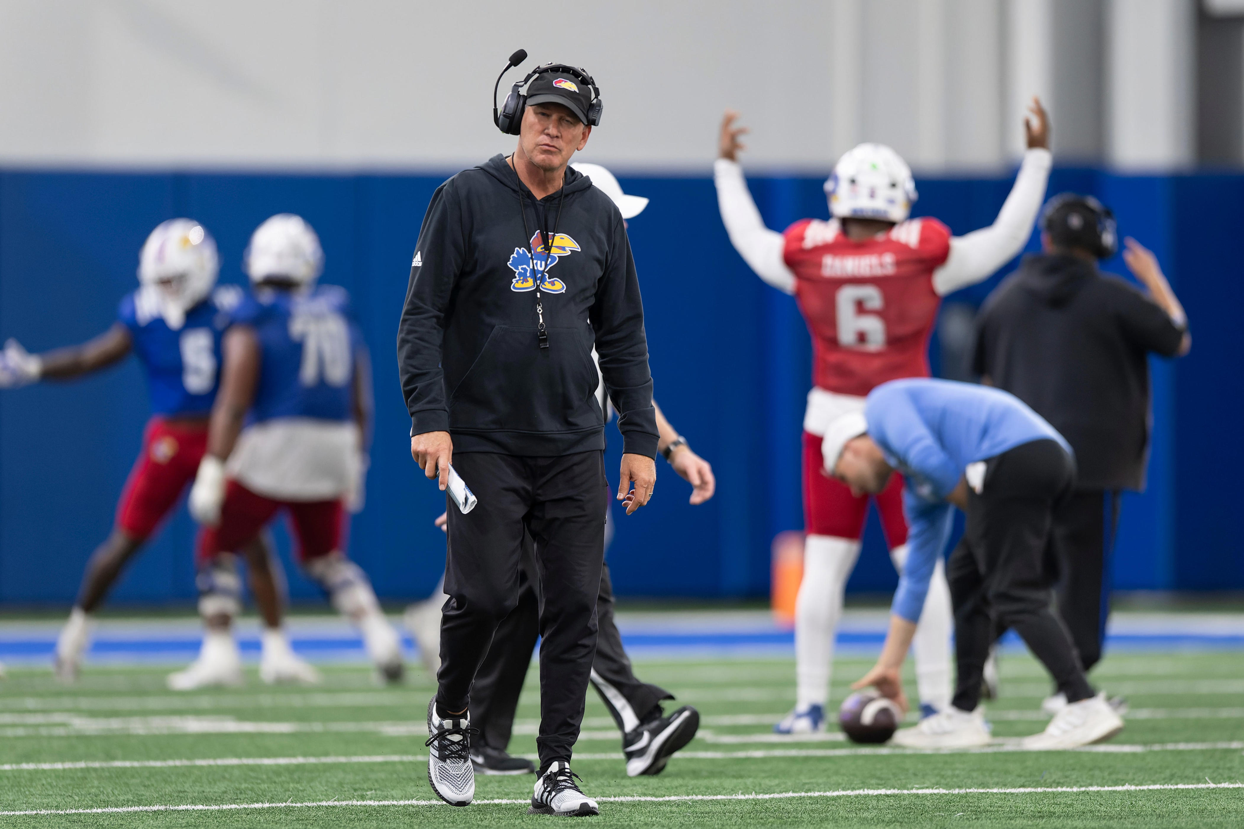 2 Kansas football assistant coaches receive raises, new job titles