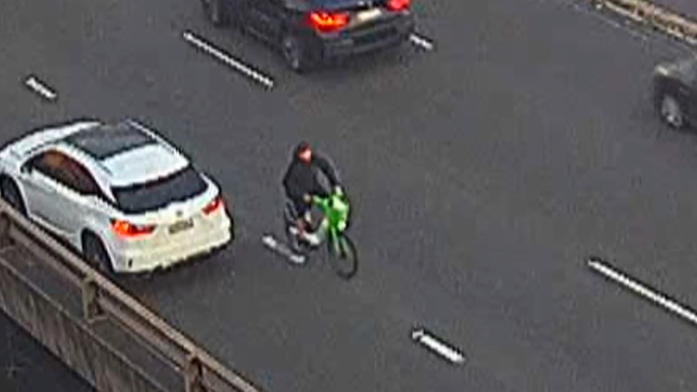 Man fined $1000 after riding e-bike against traffic on major bridge