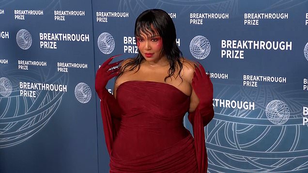 Slim Lizzo shows off her weight loss in a stunning strapless red gown