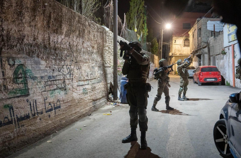 Security forces arrest 15 wanted persons in overnight West Bank op.
