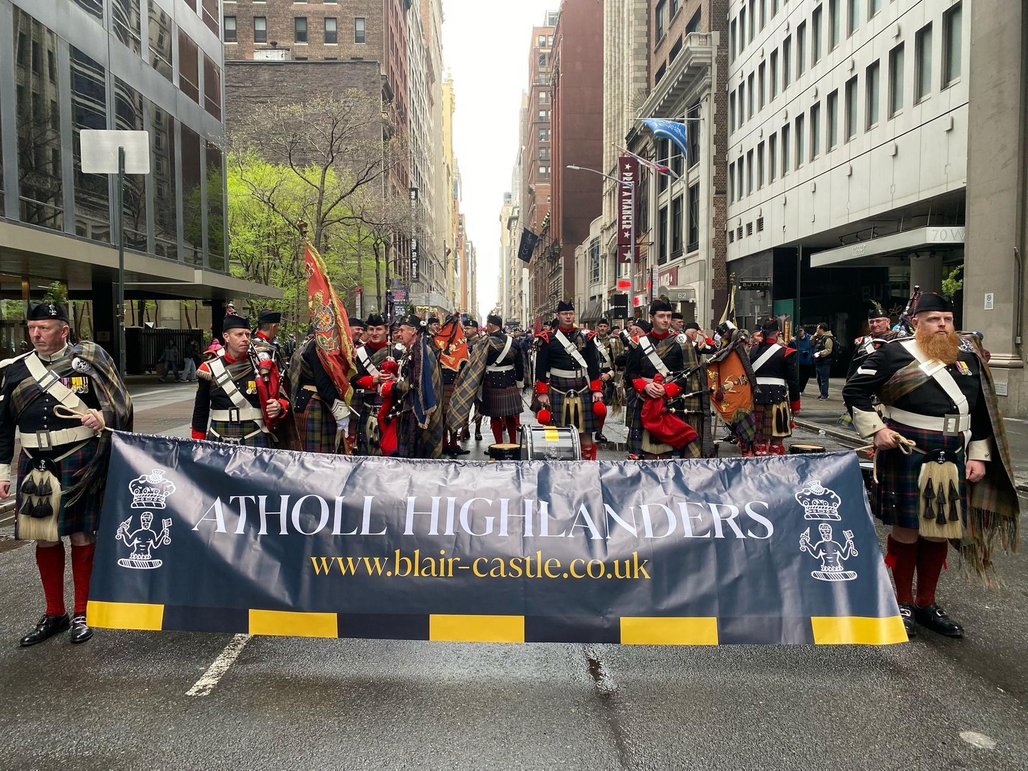 Blair Castle's Atholl Highlanders celebrate their march in New York ...
