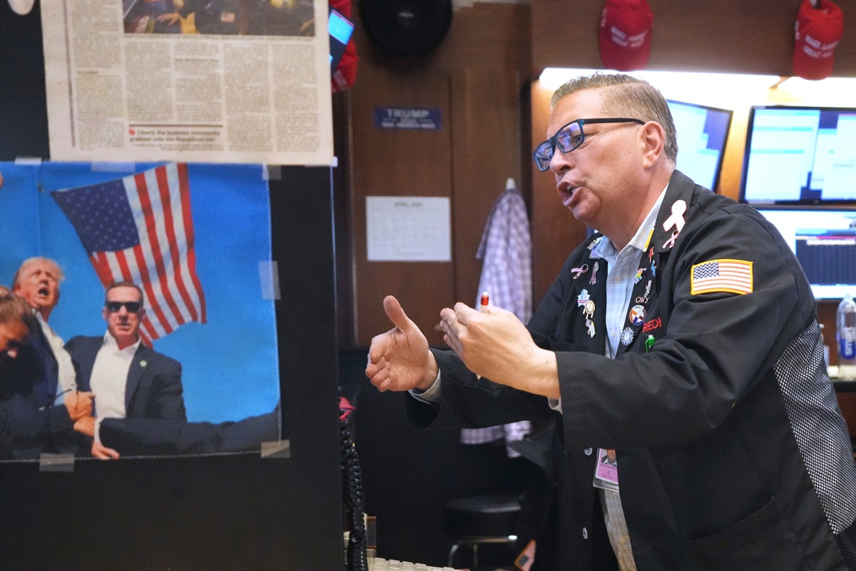 Seesaw day ends with Dow down as Trump’s tariff reports send stock ...