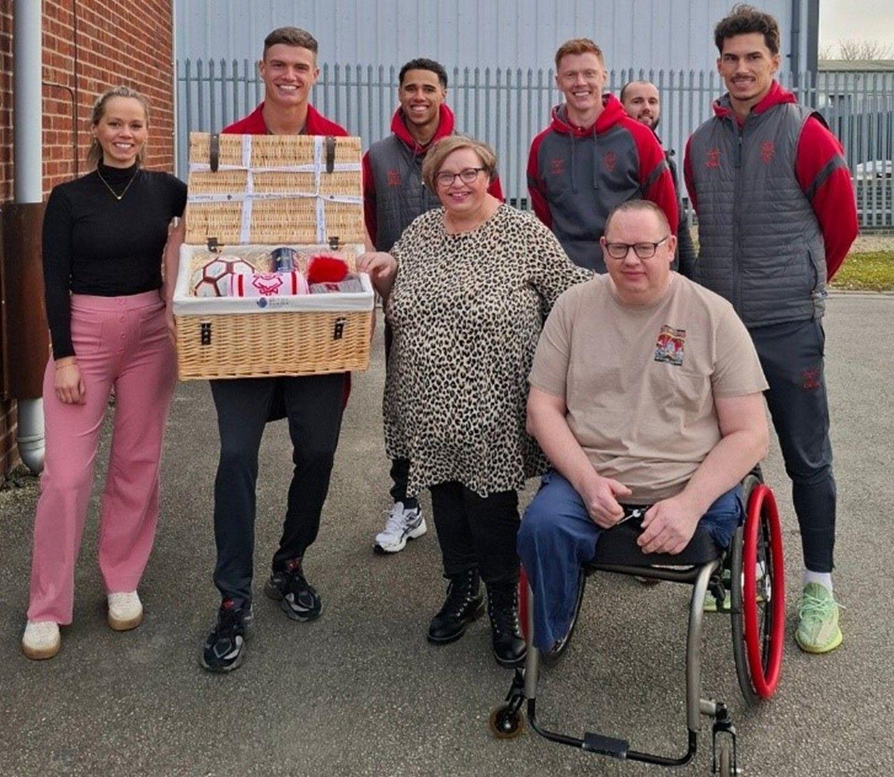 Local carer celebrated as she meets favourite Lincoln City FC players