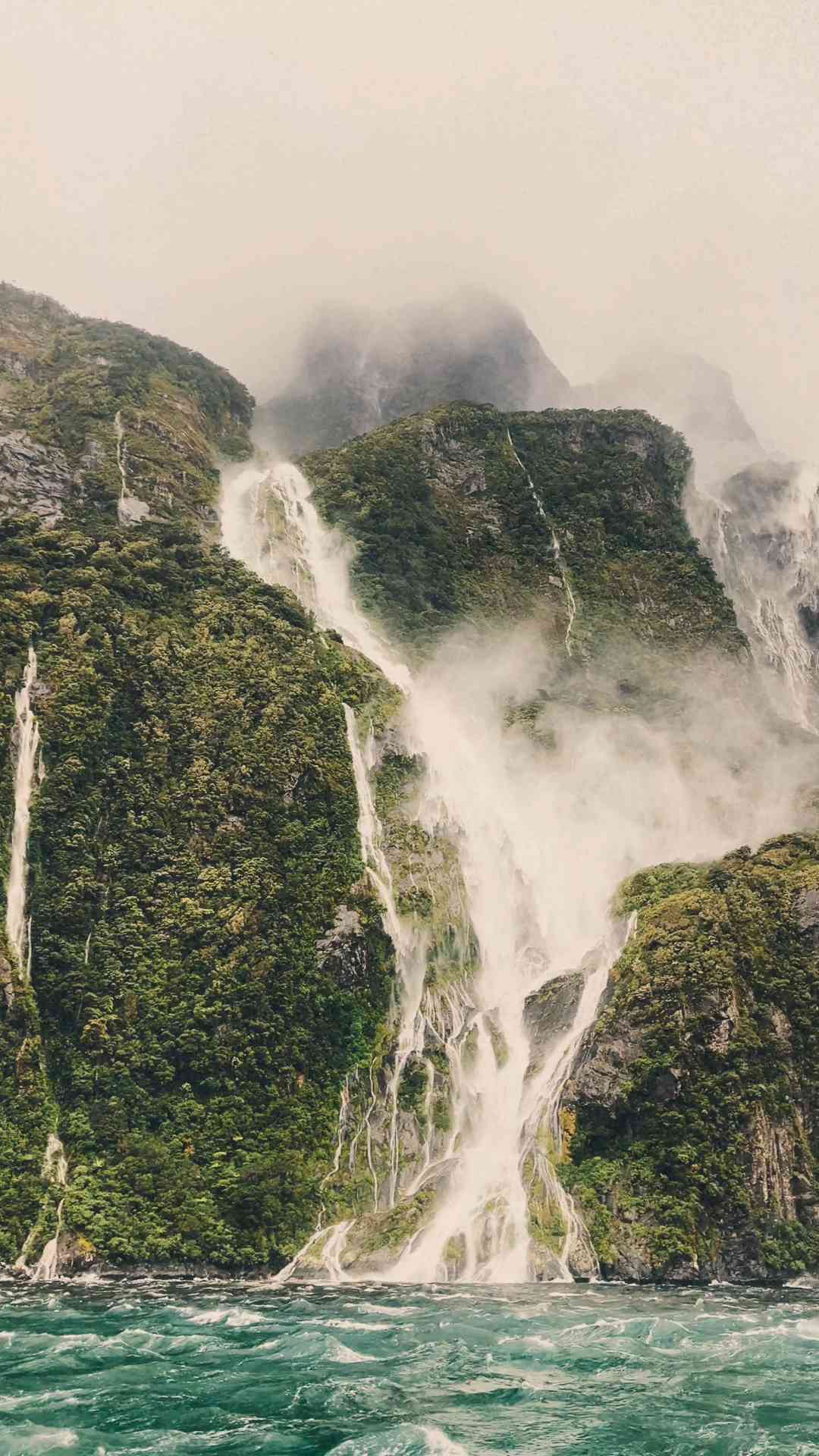 Majestic Waterfalls Cascading Down Lush Cliffs
