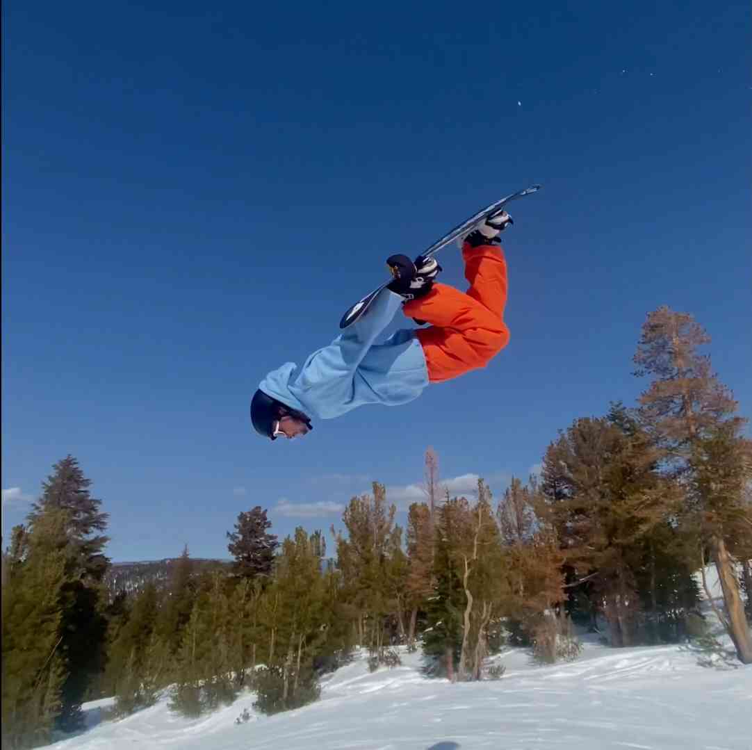 Epic Snowboarding Tricks on a Sunny Mountain Slope