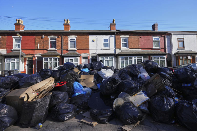 Garbage piles up on Birmingham's streets as a sanitation strike in the ...