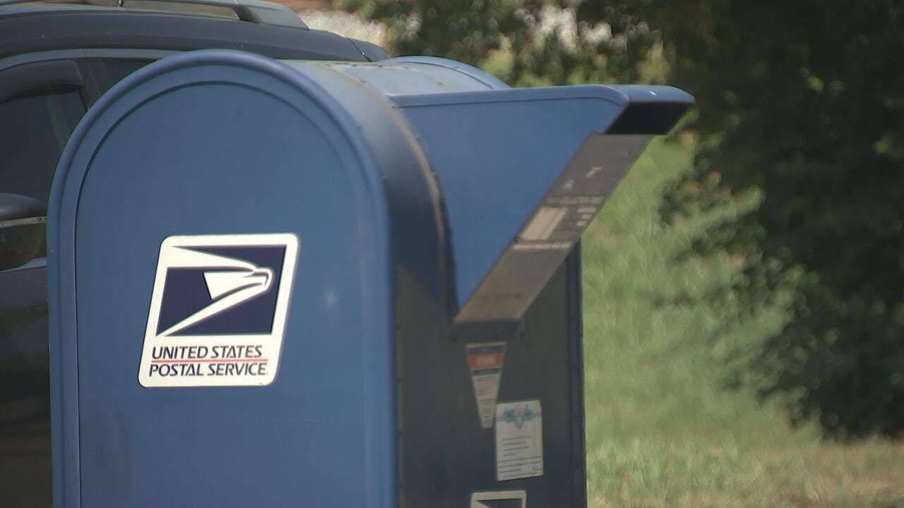 Mail scatters across I-40 after USPS truck drops several crates