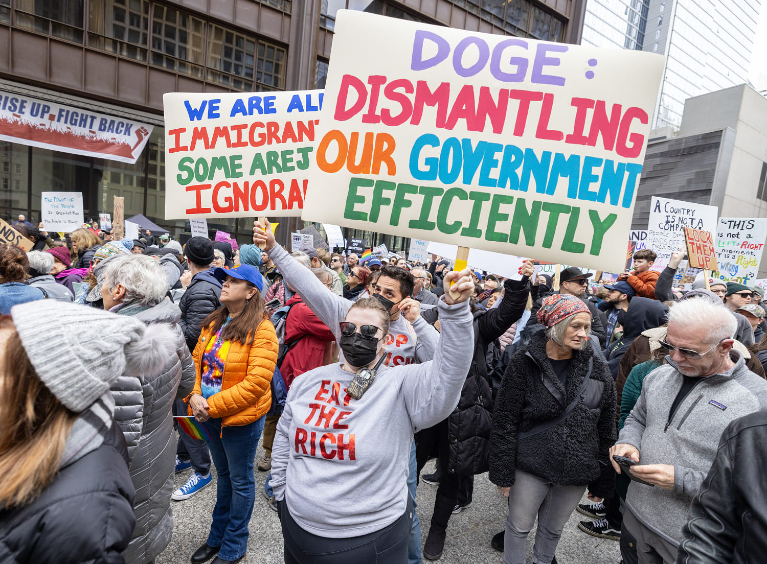 14 eye-catching ‘Hands Off’ protest signs from anti-Trump demonstrations
