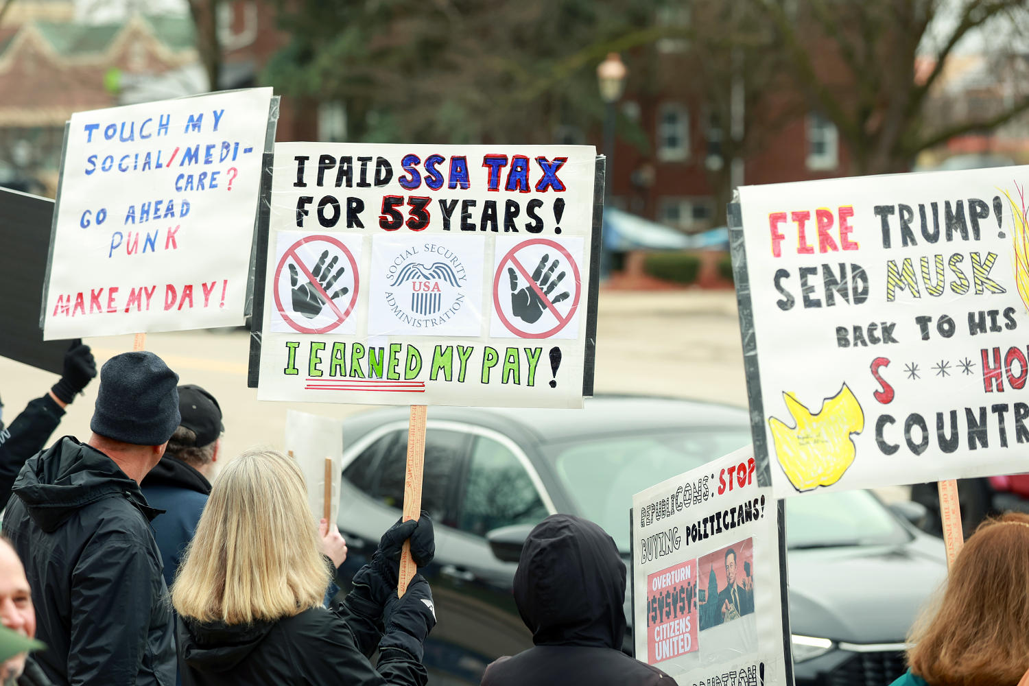 14 eye-catching ‘Hands Off’ protest signs from anti-Trump demonstrations