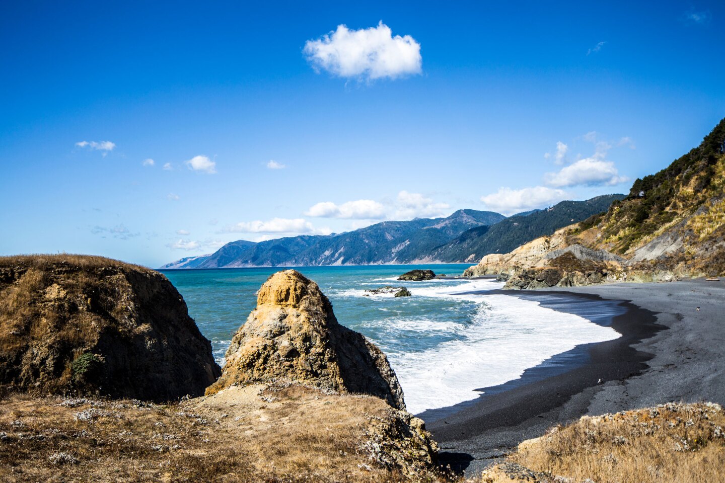 8 Strikingly Beautiful Black-Sand Beaches Around the World