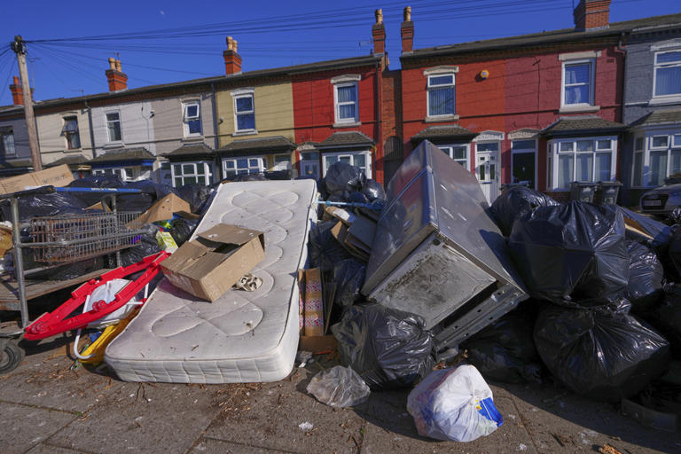 Garbage piles up on Birmingham's streets as a sanitation strike in the ...
