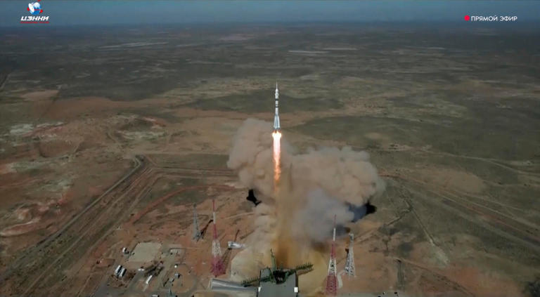 Rocket carrying NASA's Jonny Kim, 2 cosmonauts docks with space station