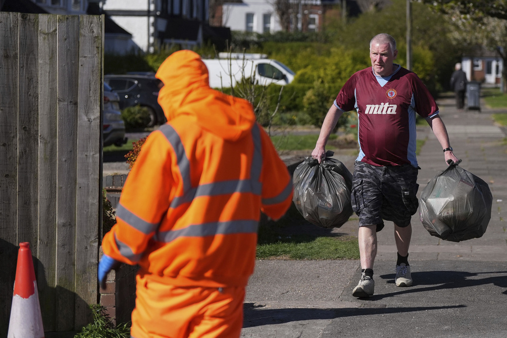 Garbage piles up on Birmingham's streets as a sanitation strike in the ...