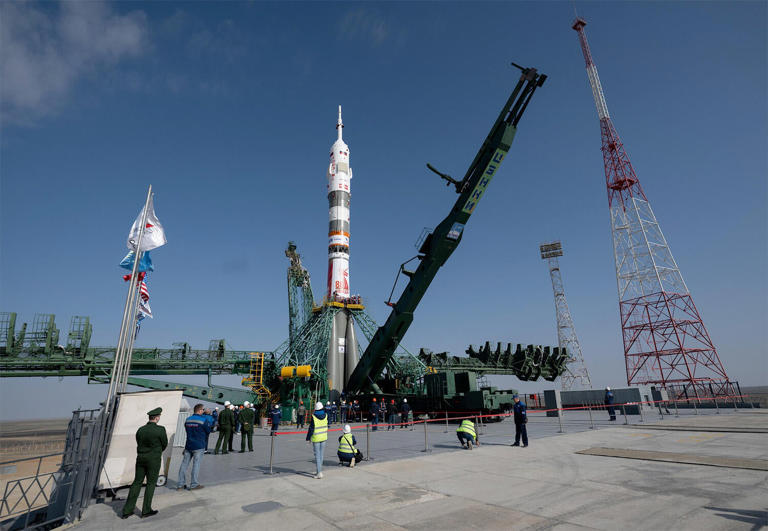 Rocket carrying NASA's Jonny Kim, 2 cosmonauts docks with space station