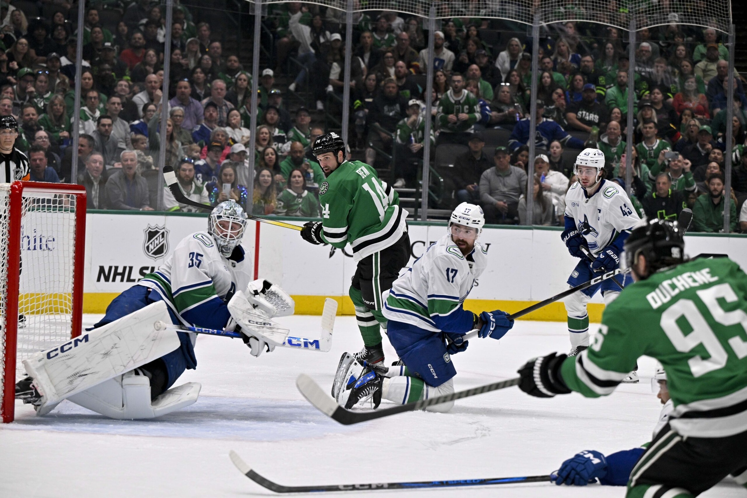 Canucks score three goals in final minute to cap off wild OT comeback ...