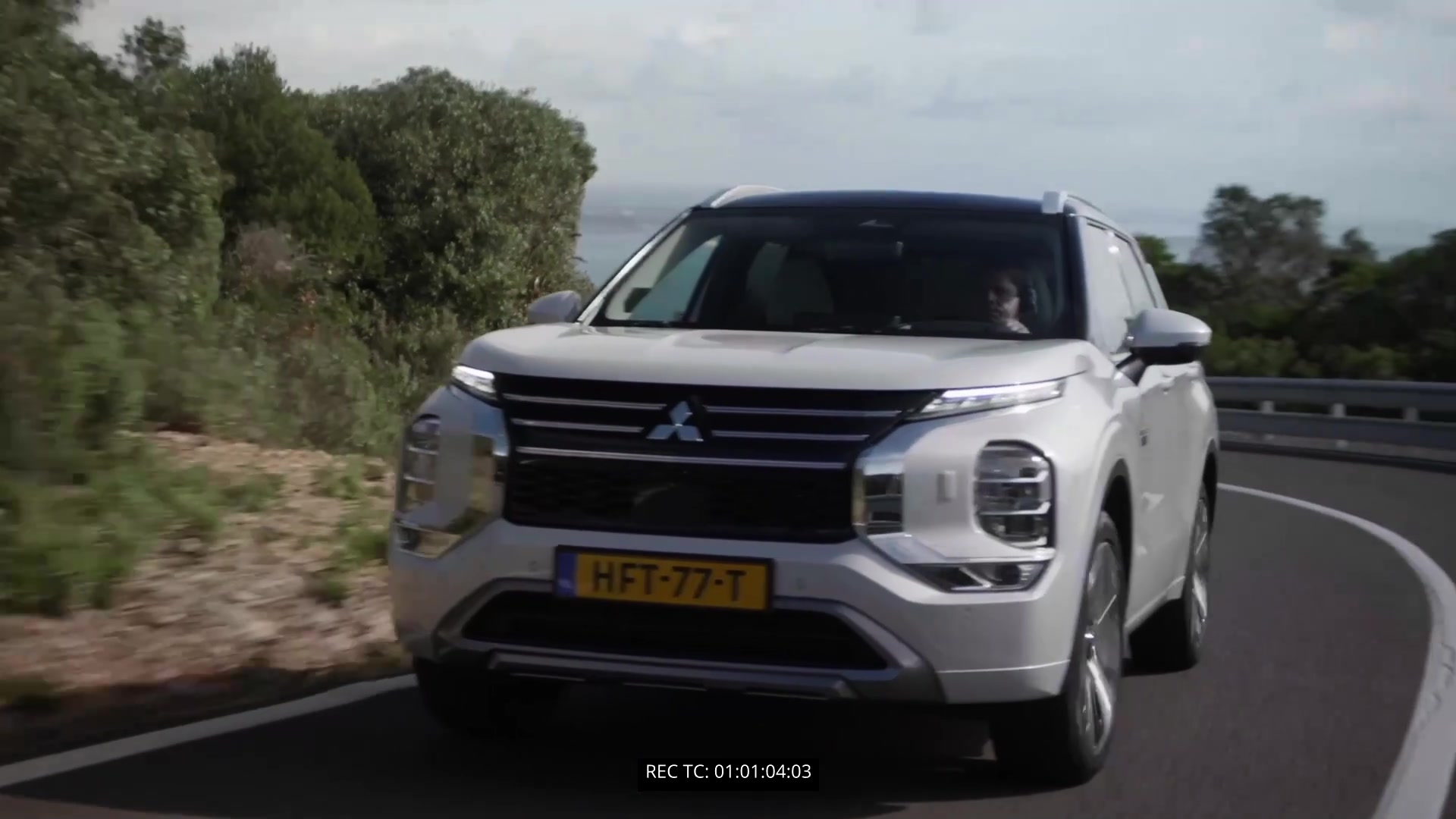 New Mitsubishi Outlander PHEV in White Diamond Driving Video