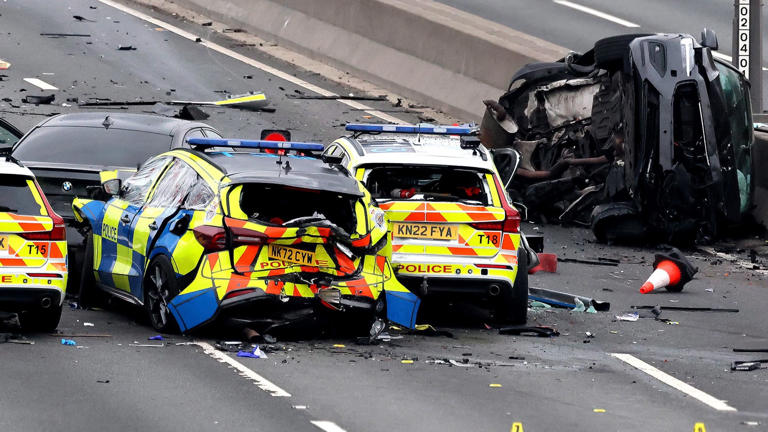 Huge crash involving at least police cars closes major road