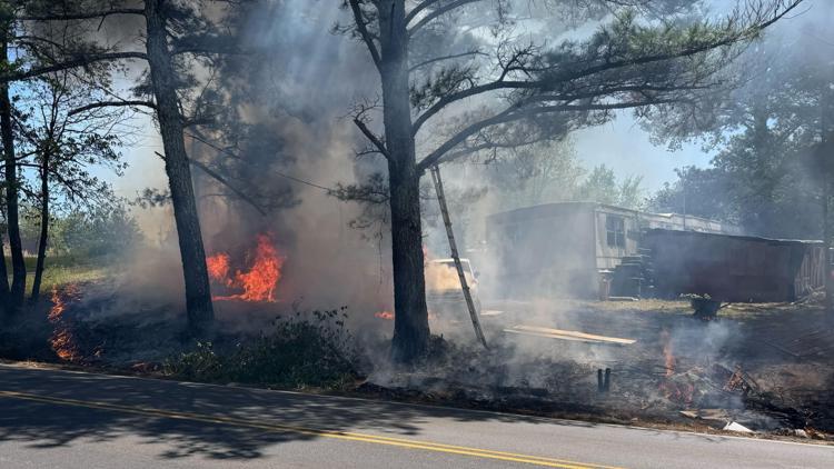 Harvest fire damages cars, crews contain flames near home
