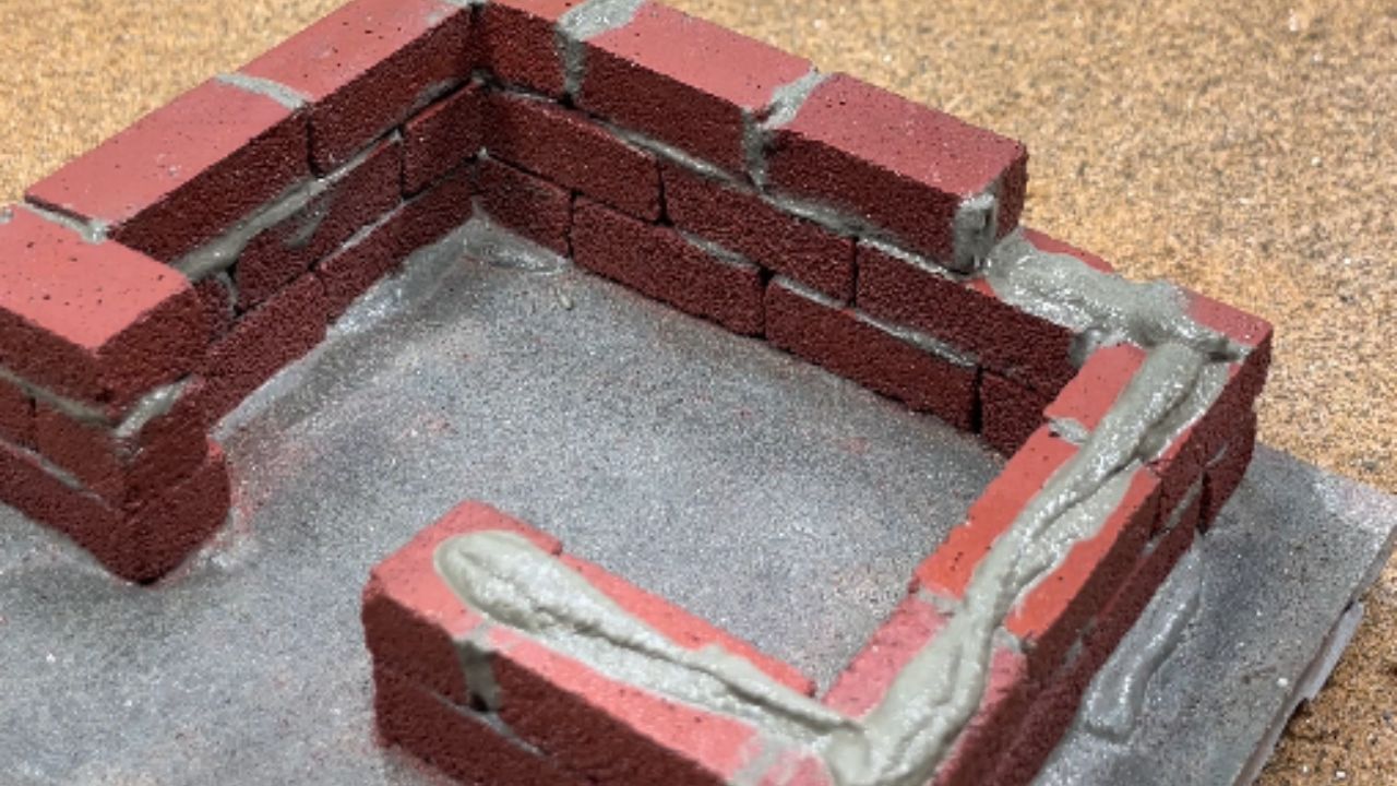 Artist brings a miniature house to life with tiny bricks, window, and ...