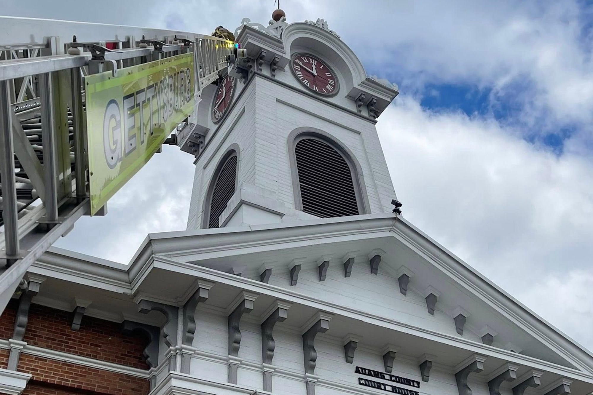 Firefighters help repair historic Adams County Courthouse clock tower ...