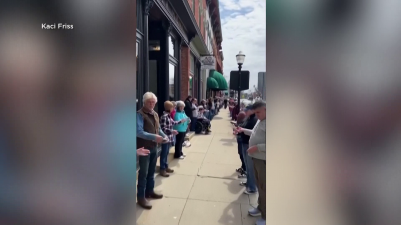 ‘Book brigade’ helps Michigan shop move 9,100 books one by one