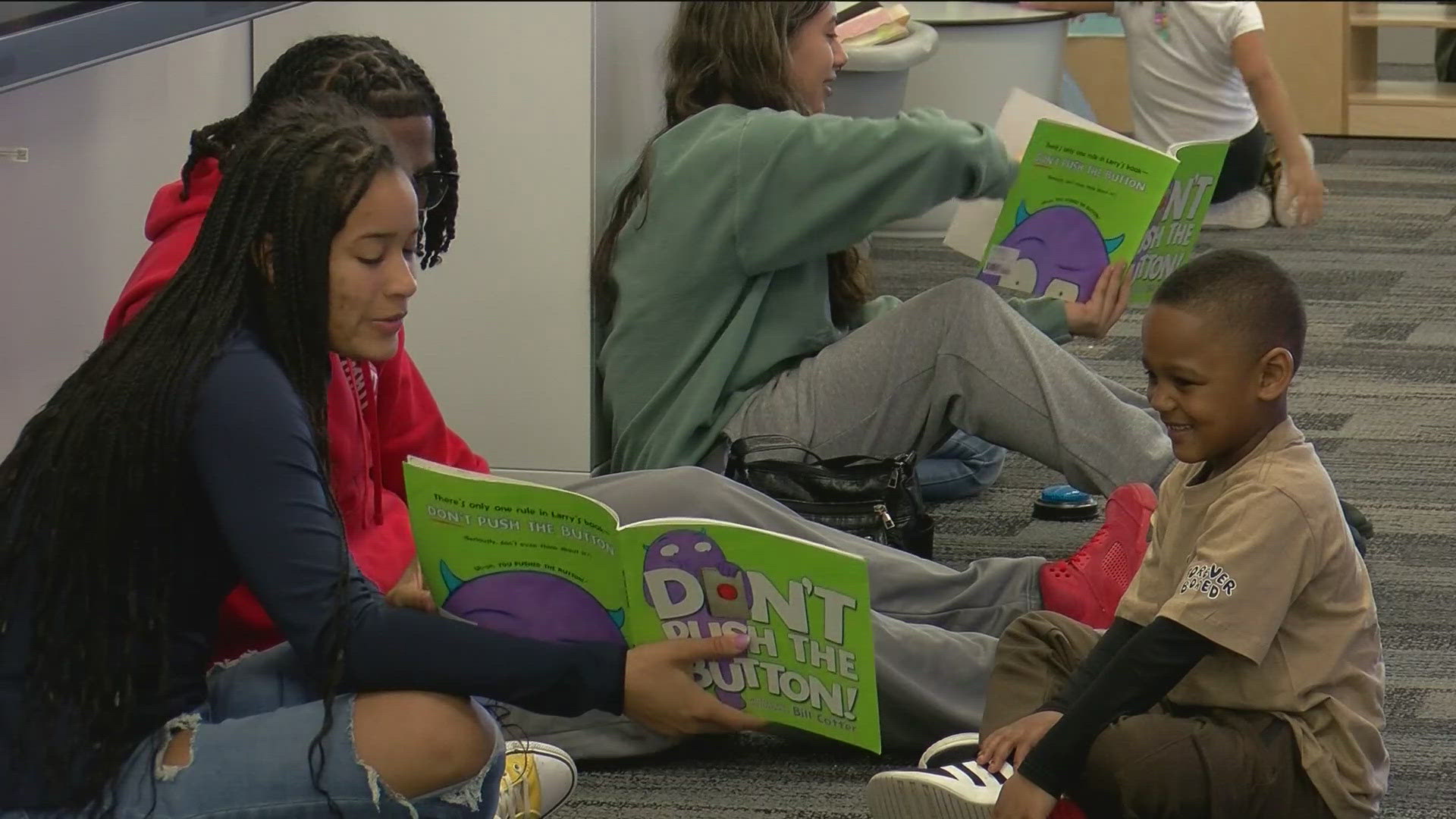 'Reading' by example: Whitmer students spend time with kindergarteners at Silver Creek Elementary