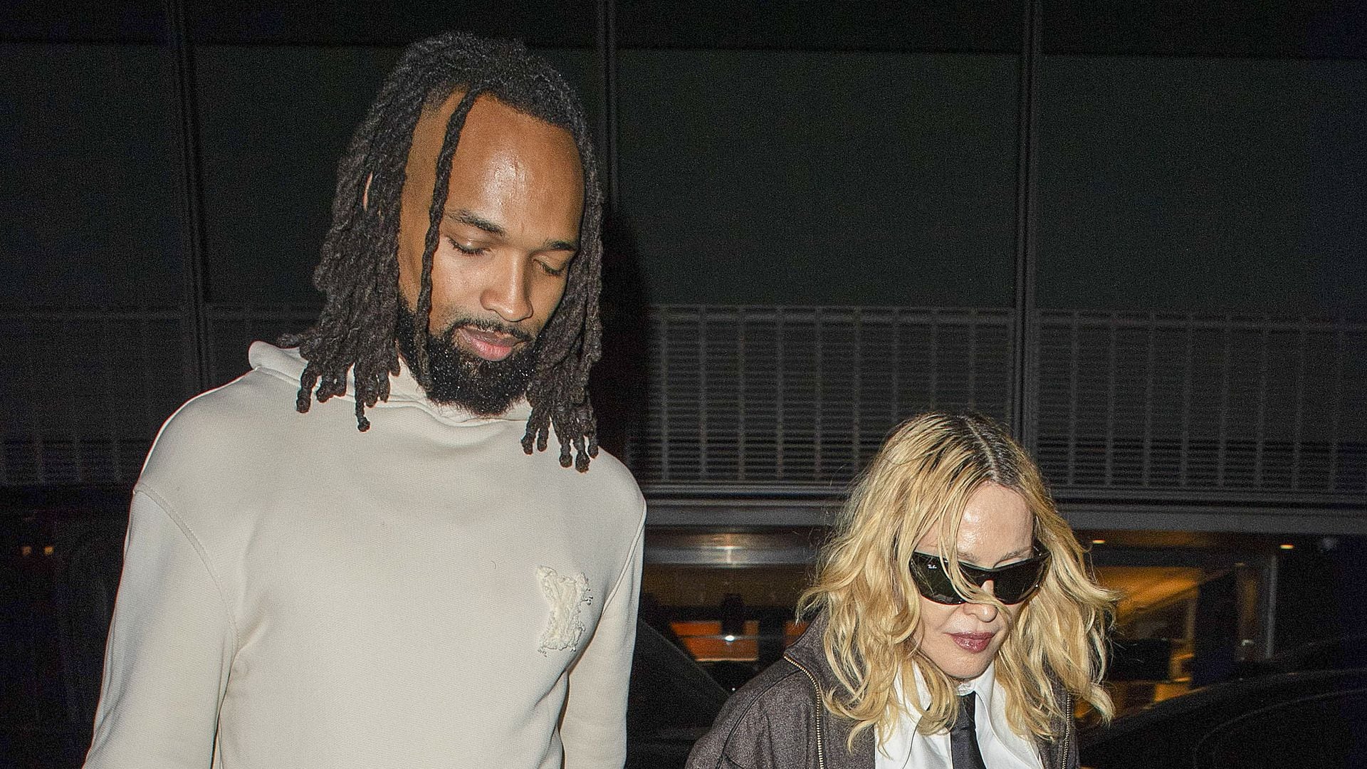 Madonna suits up for a rooftop date night with her boyfriend Akeem Morris