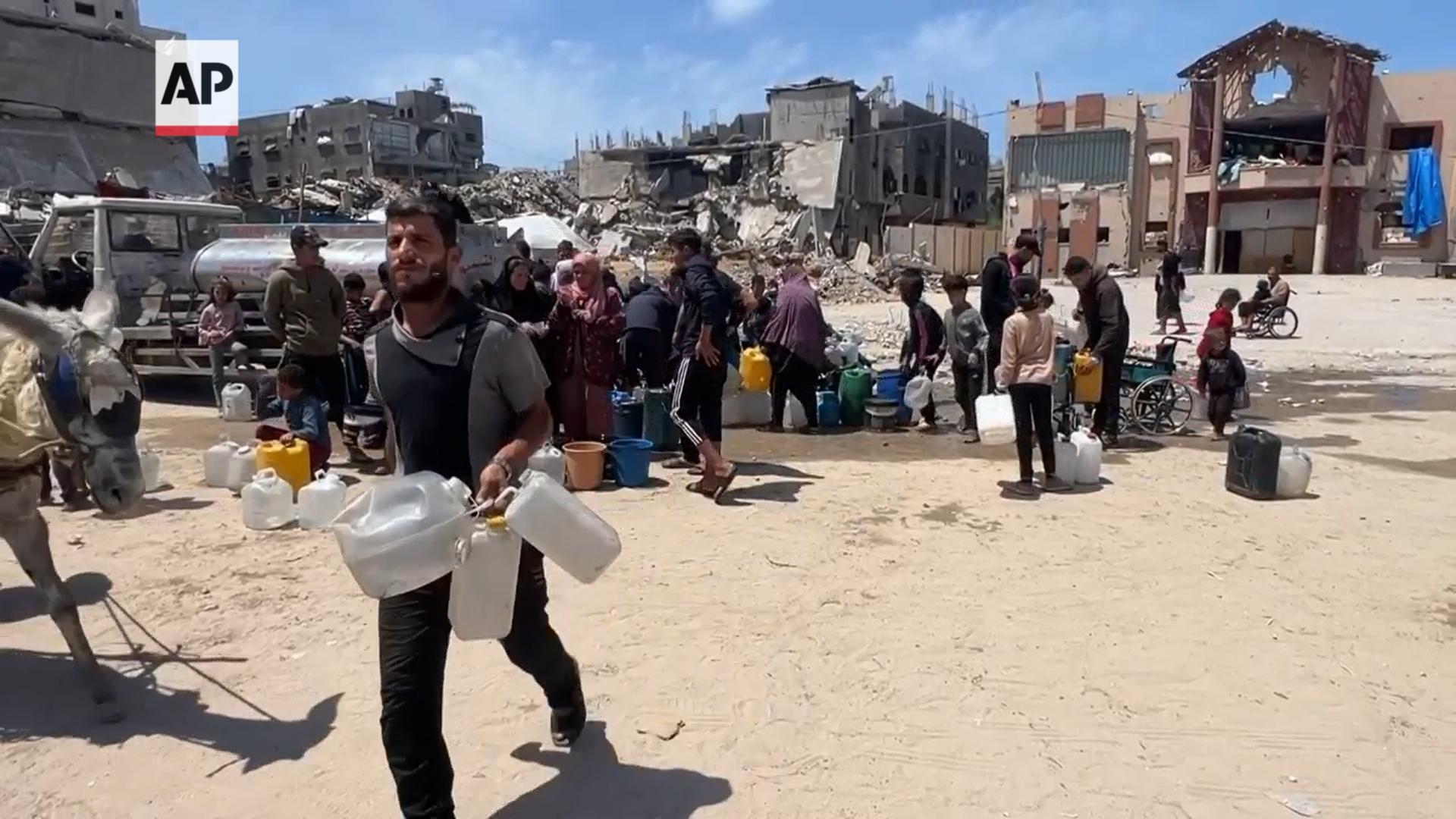 Palestinians line up for water as scarcity continues across the Gaza Strip