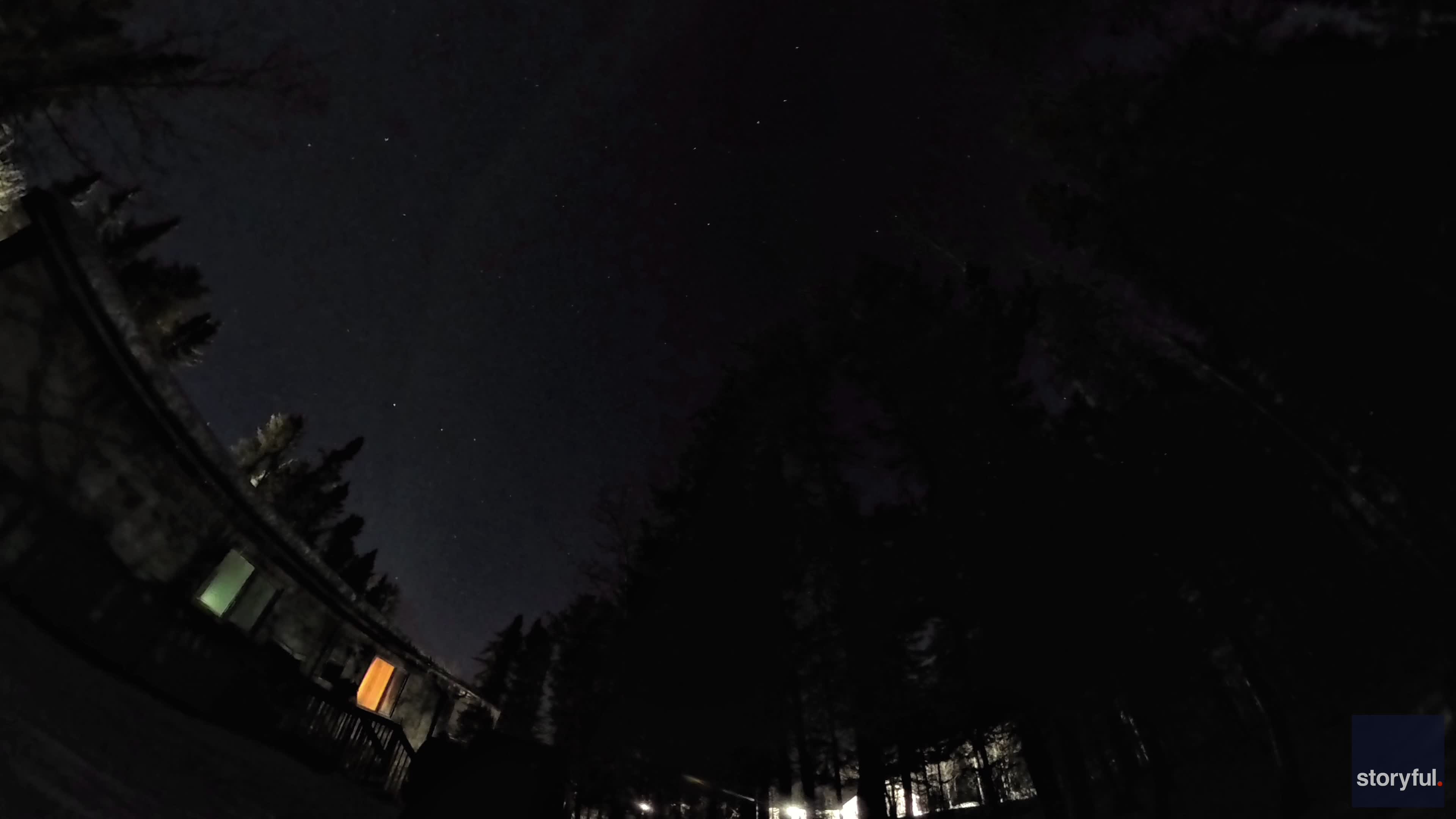 Glowing Green Aurora Shimmers in the Night Sky Above Manitoba Home