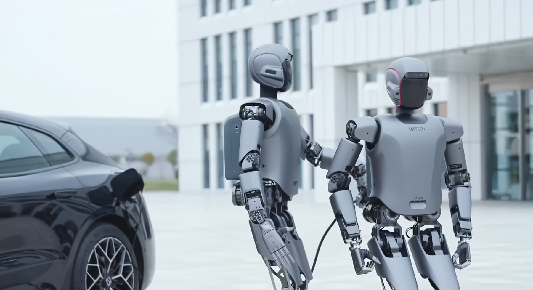 Zeekr shows humanoid robots charging each other, their EV car