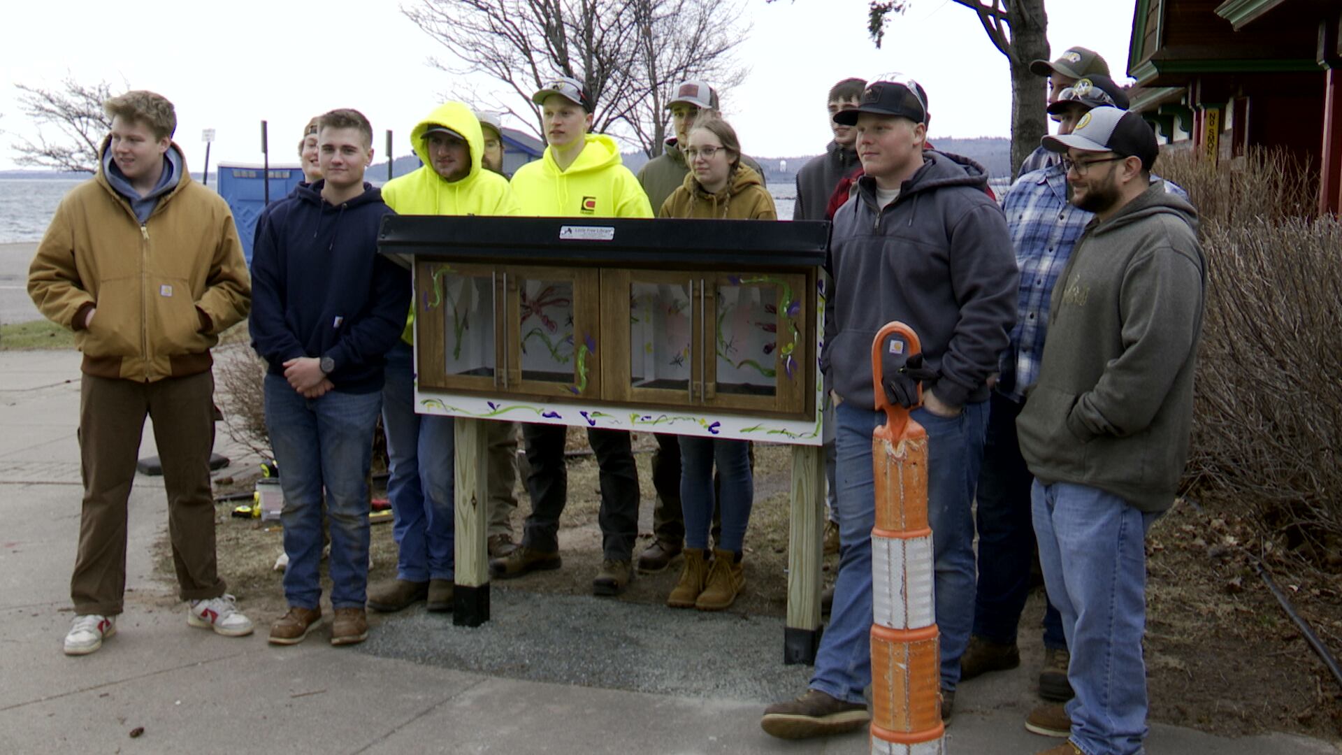 NMU student group installs ADA-compliant library at Kids Cove II Playground