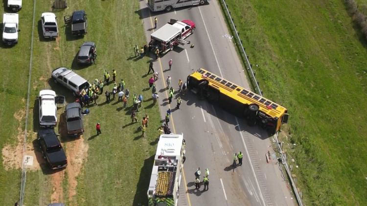 1 dead, multiple hurt after school bus overturns on I-77, officials say 1 dead, multiple hurt after school bus overturns on I-77, officials say