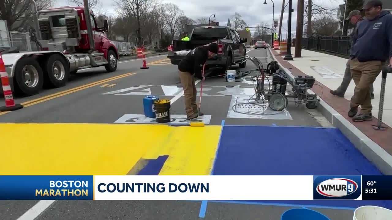 Workers put down finish line with Boston Marathon days away