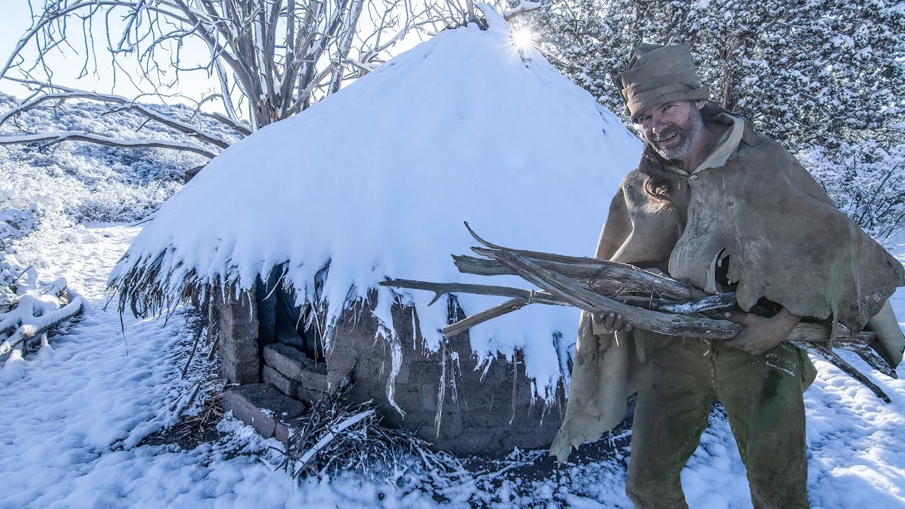 Building a Primitive Winter Survival Shelter with ONLY Mud, Sticks and Bark
