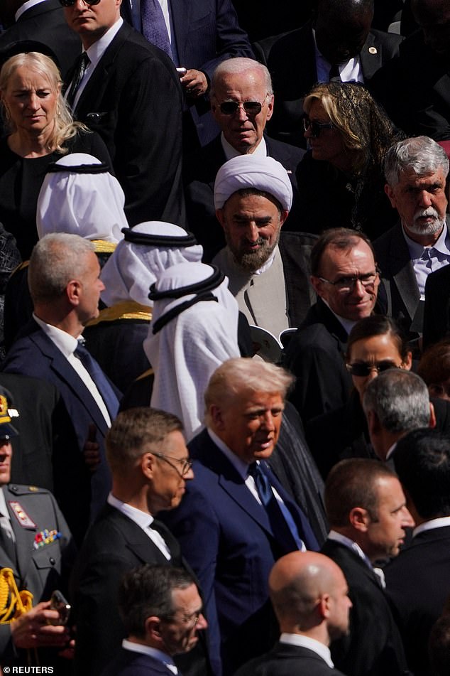 Biden looks frail at Pope Francis' funeral as he tightly grips onto ...