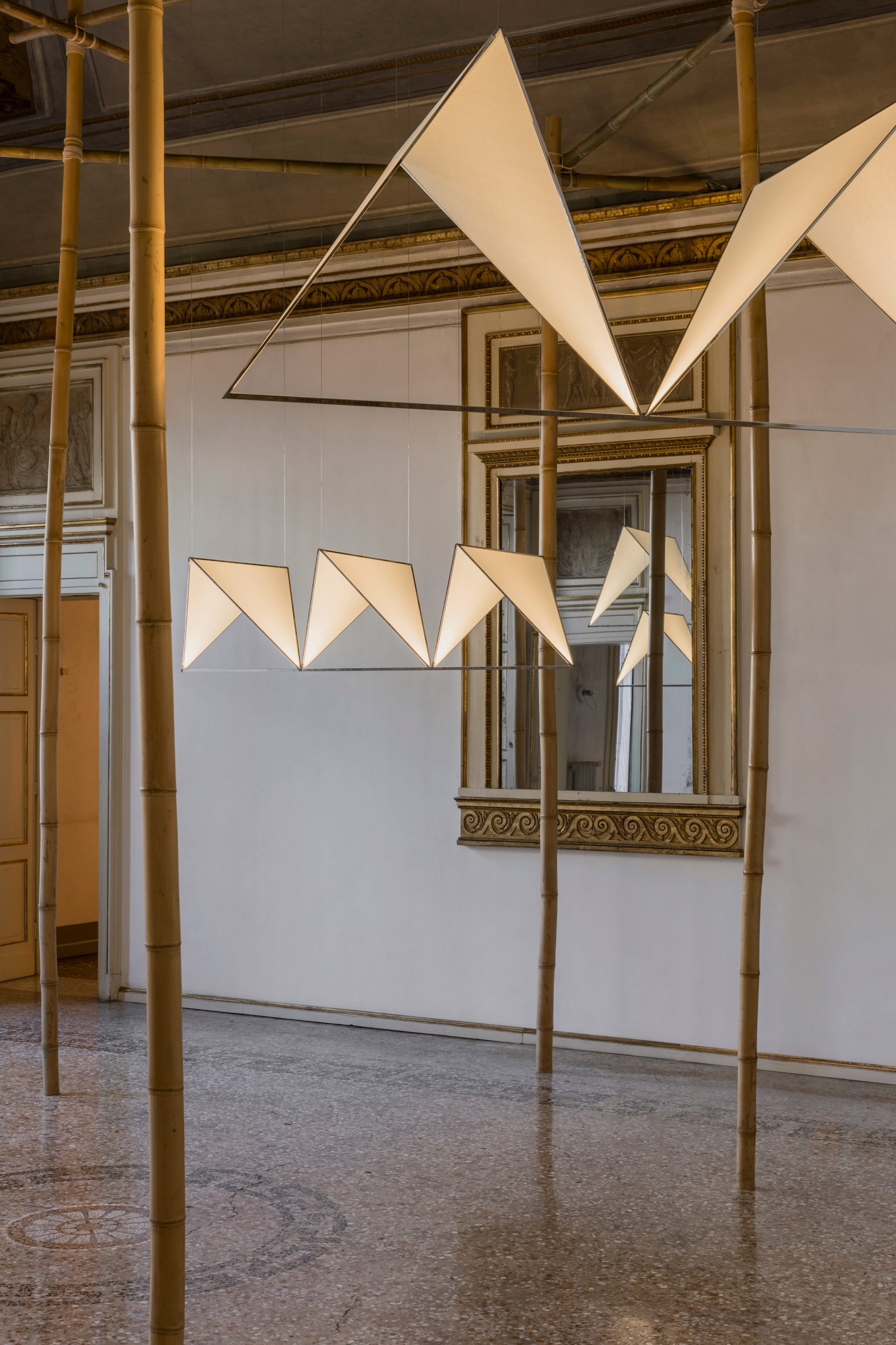 Michael Anastassiades designs triangular Cygnet light to evoke sun-lit ...