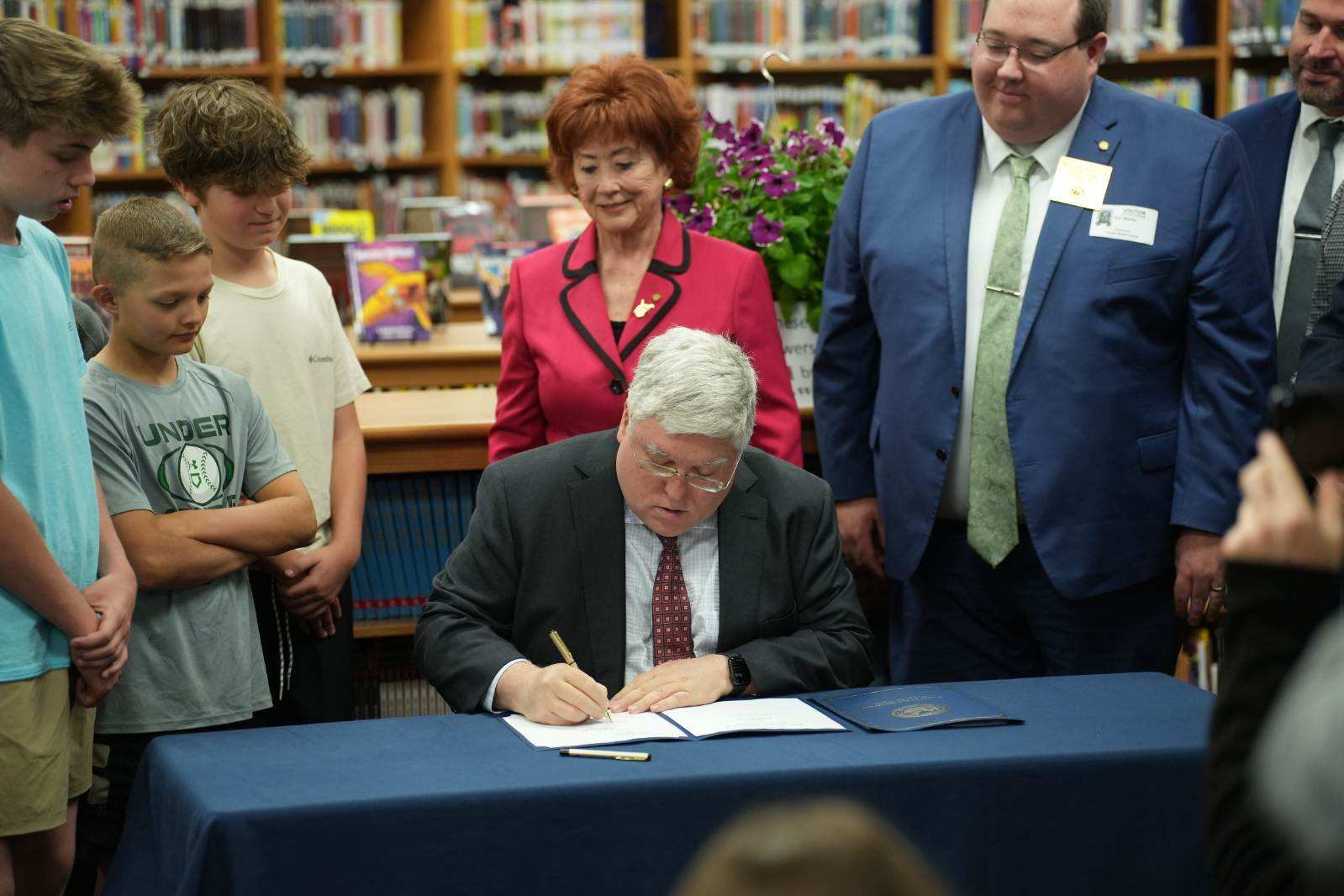 Morrisey signs bills to ban cell phones, display ‘In God We Trust’ in W ...