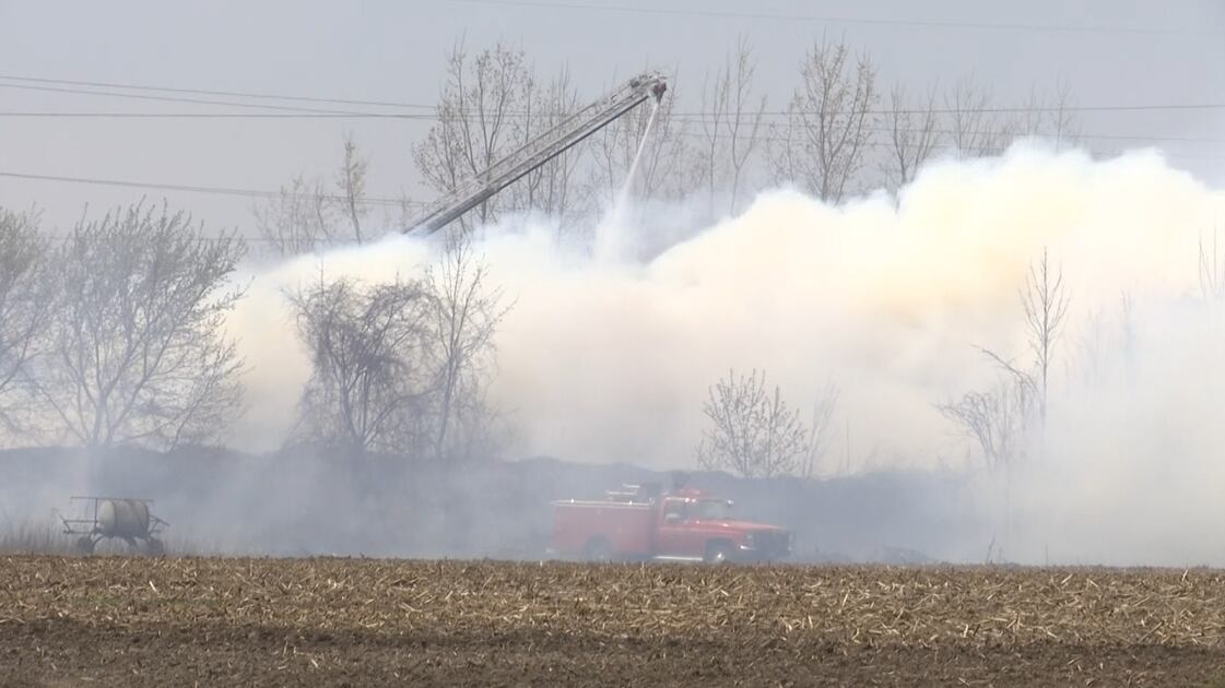 Crews work to put out mulch pile fire in Bay Co.