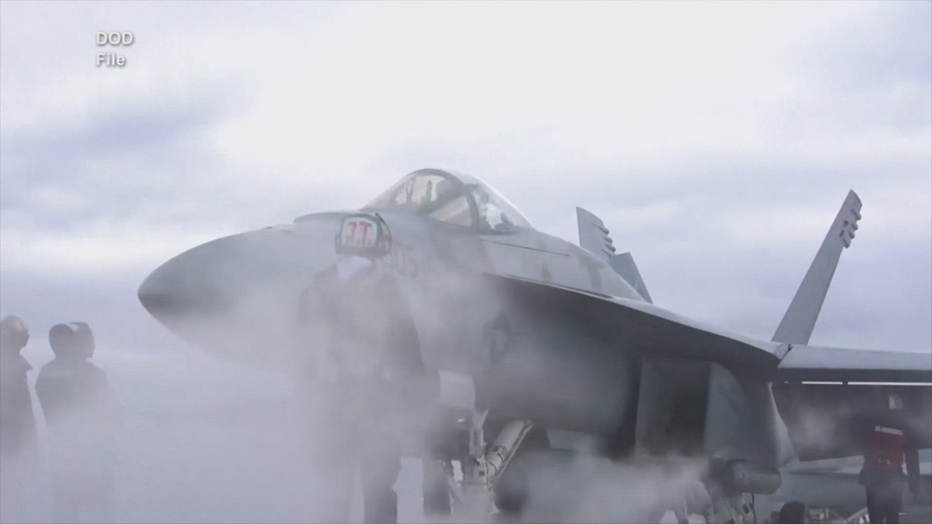 U.S. Navy fighter jet rolls off carrier, falls into ocean