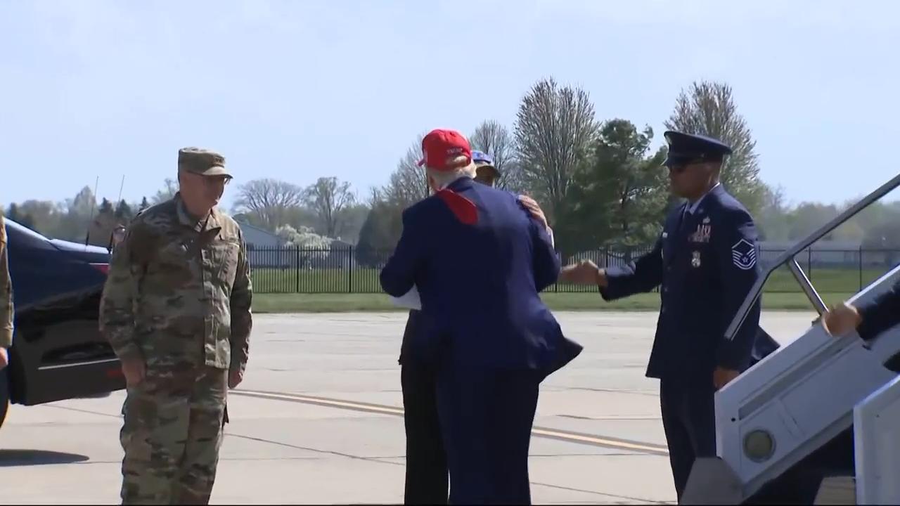 Trump shares hug with Whitmer upon arrival in Michigan