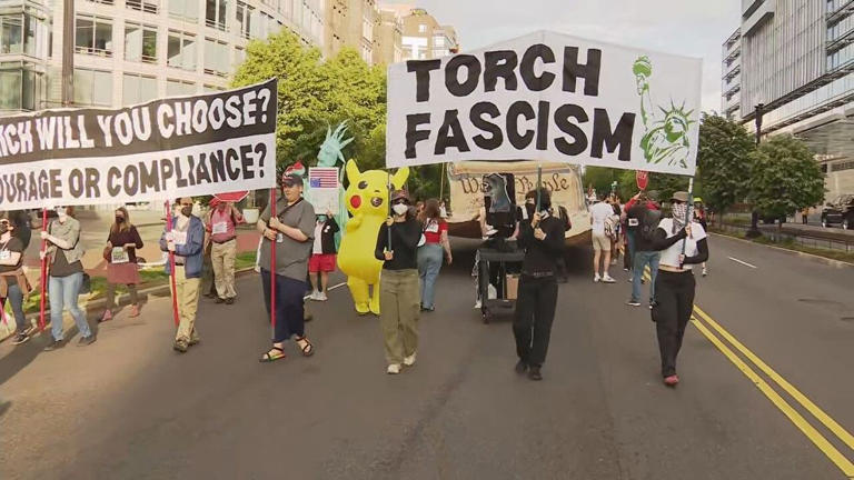 Protesters block DC rush hour to mark 100 days of 'Trump regime'