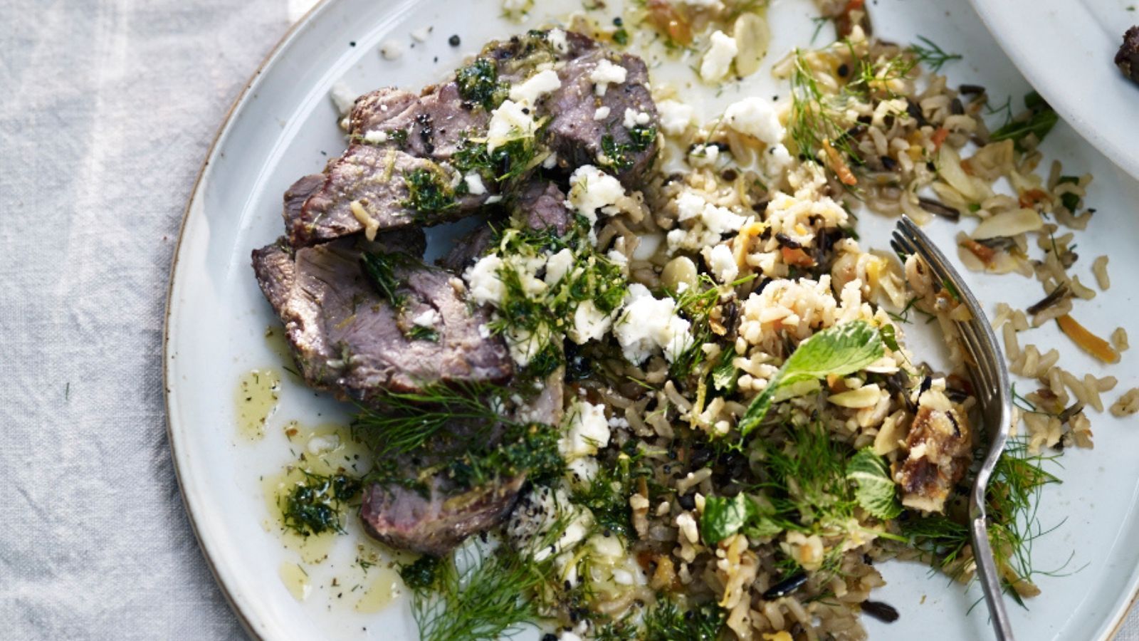 Grilled lamb with a herby carrot pilaf