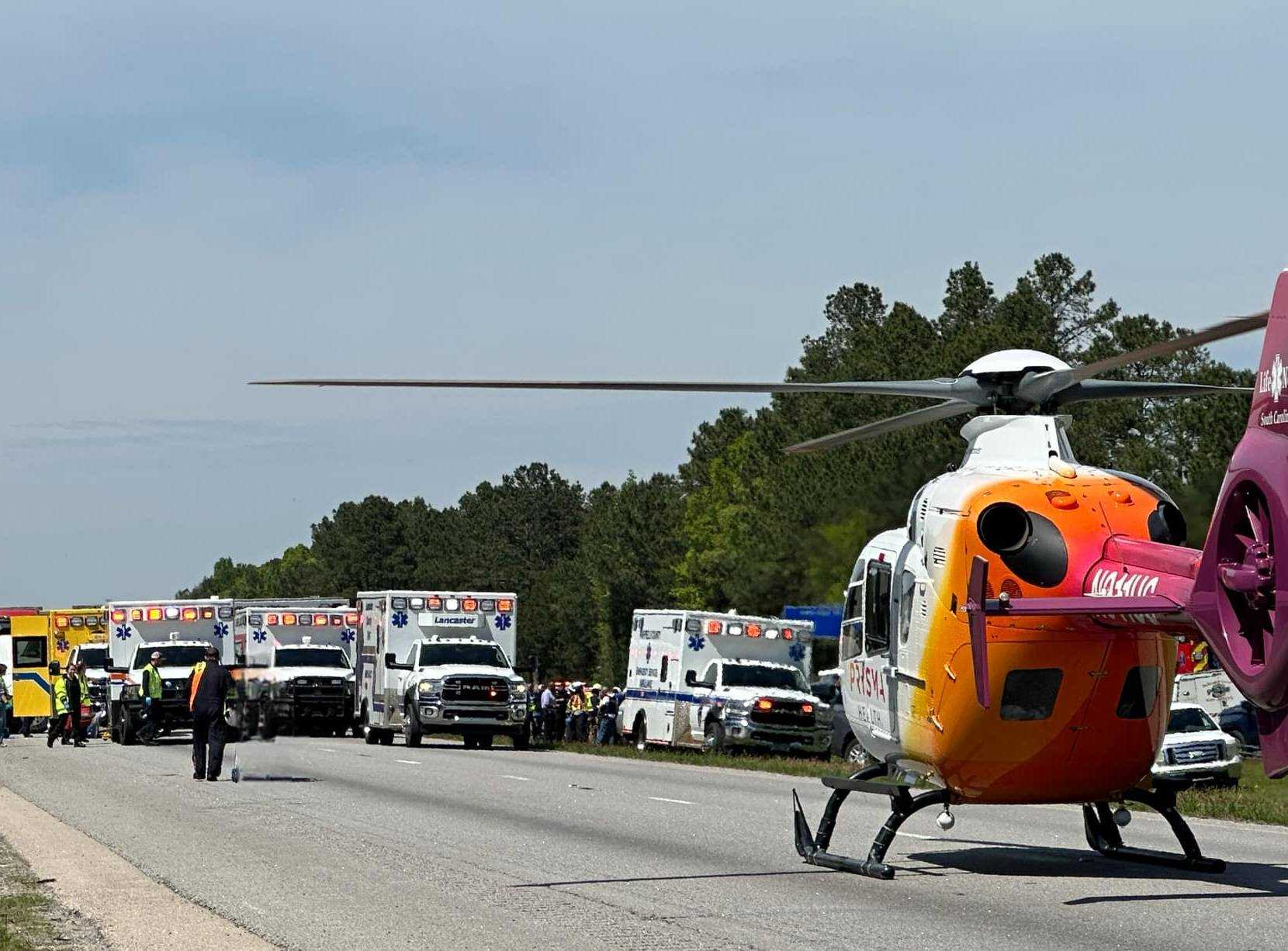 1 dead, 21 injured after school bus overturns on South Carolina interstate