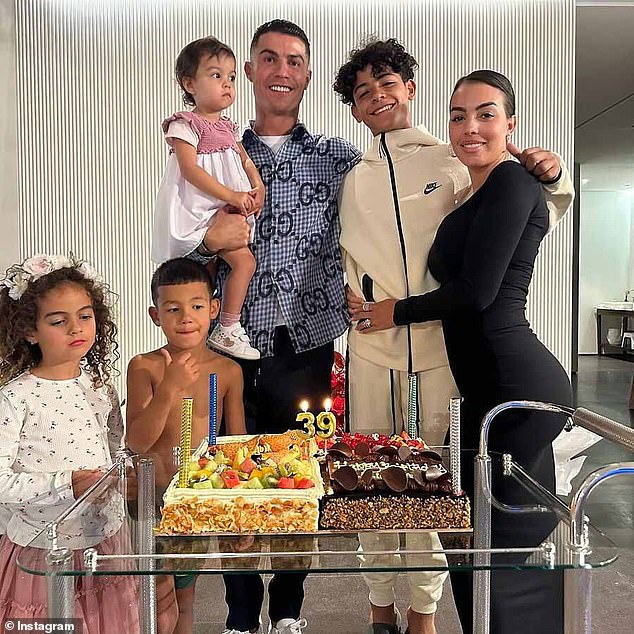 Doting dad Cristiano Ronaldo shows his softer side as footballer ...