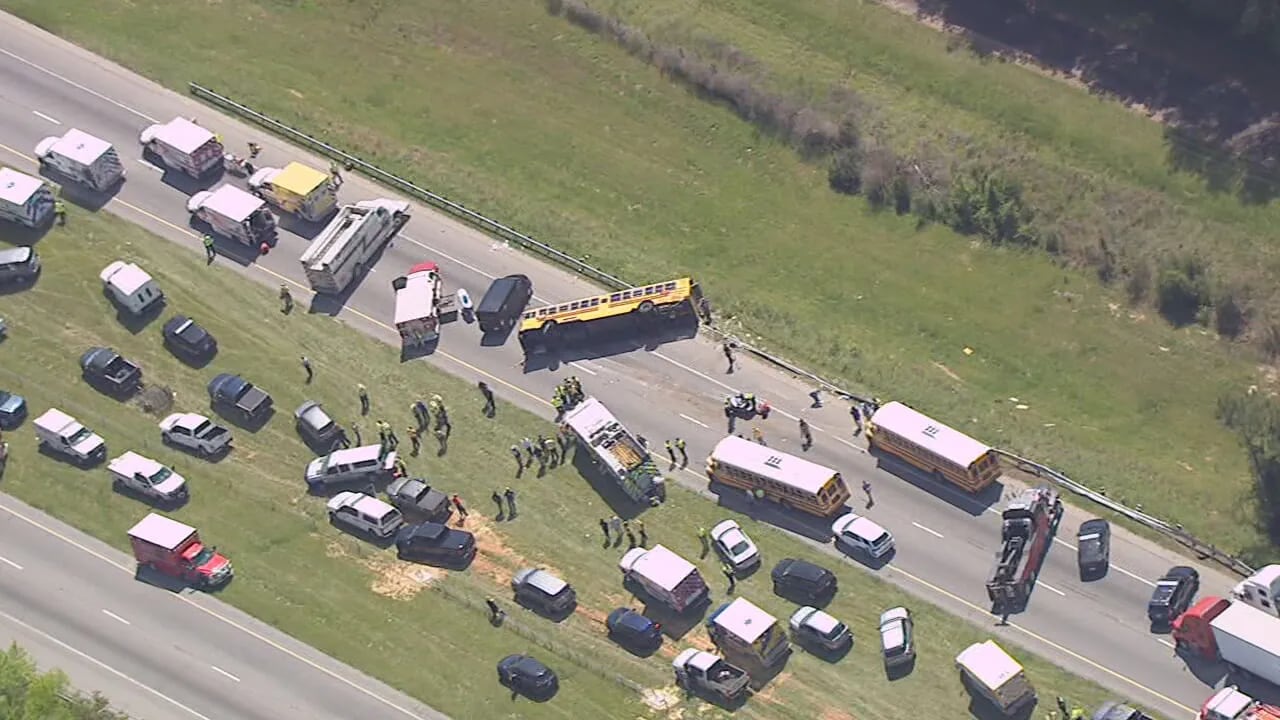 1 killed after blown tire causes school bus to flip on I-77, troopers say