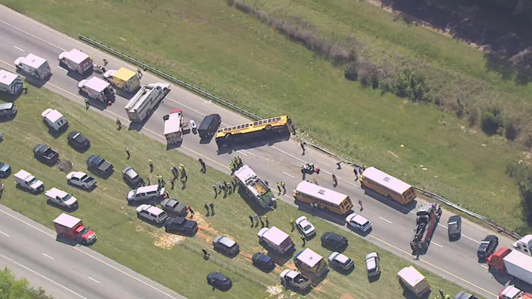 1 killed after blown tire causes school bus to flip on I-77, troopers say