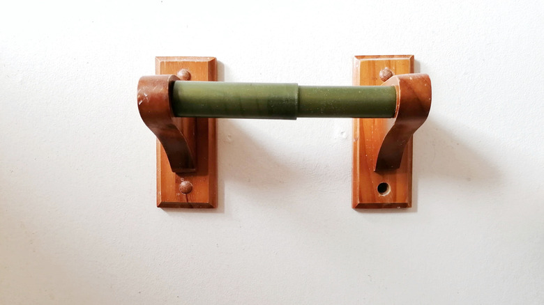 The Clever Way You Should Be Using A Toilet Paper Holder In Your Garage